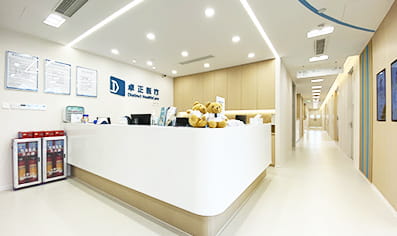 The reception desk of Guangzhou Zhujiang New Town Clinic with a ...